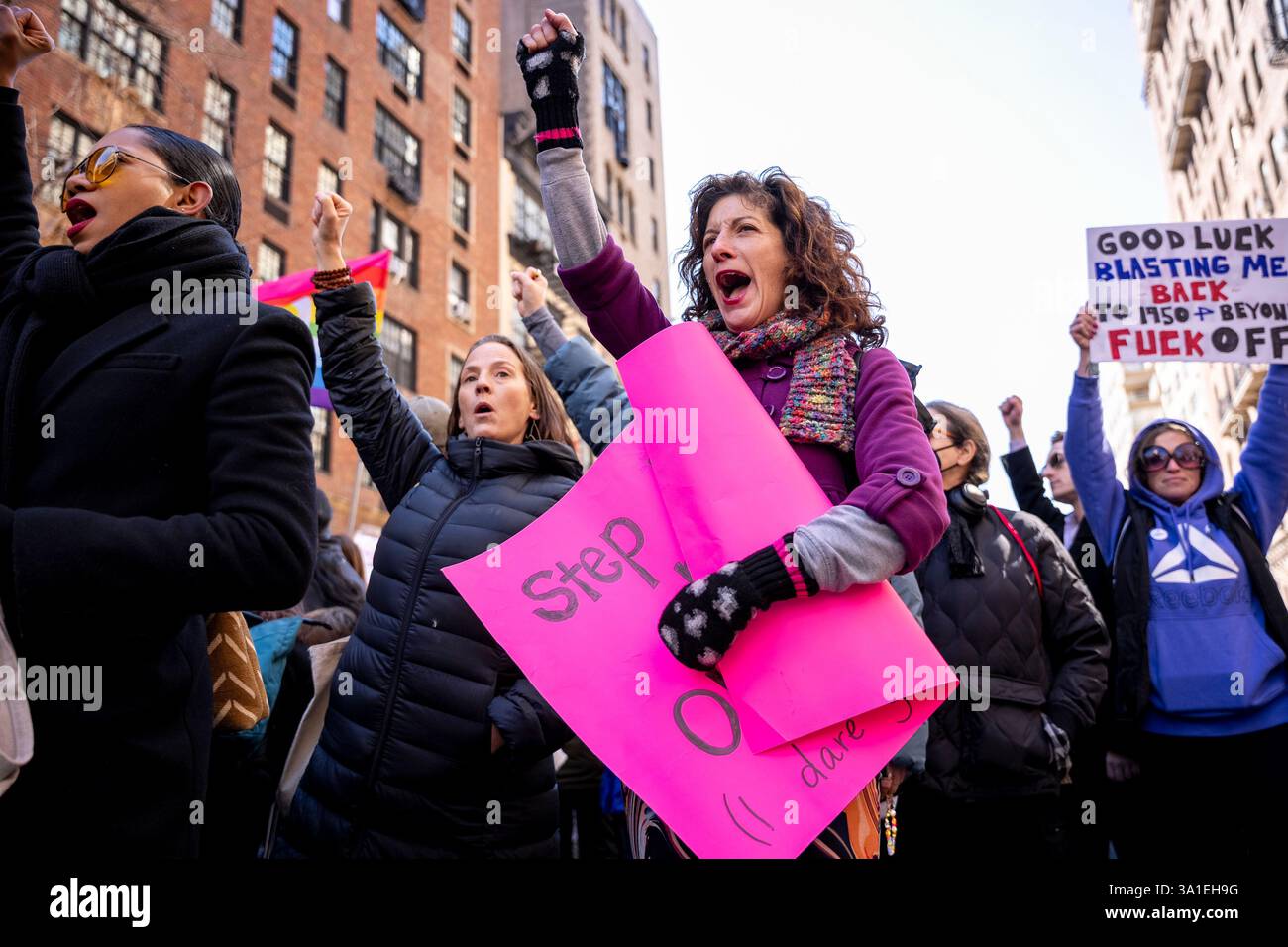 Protestors chant "Stand up fight back" at the Women's March on ...