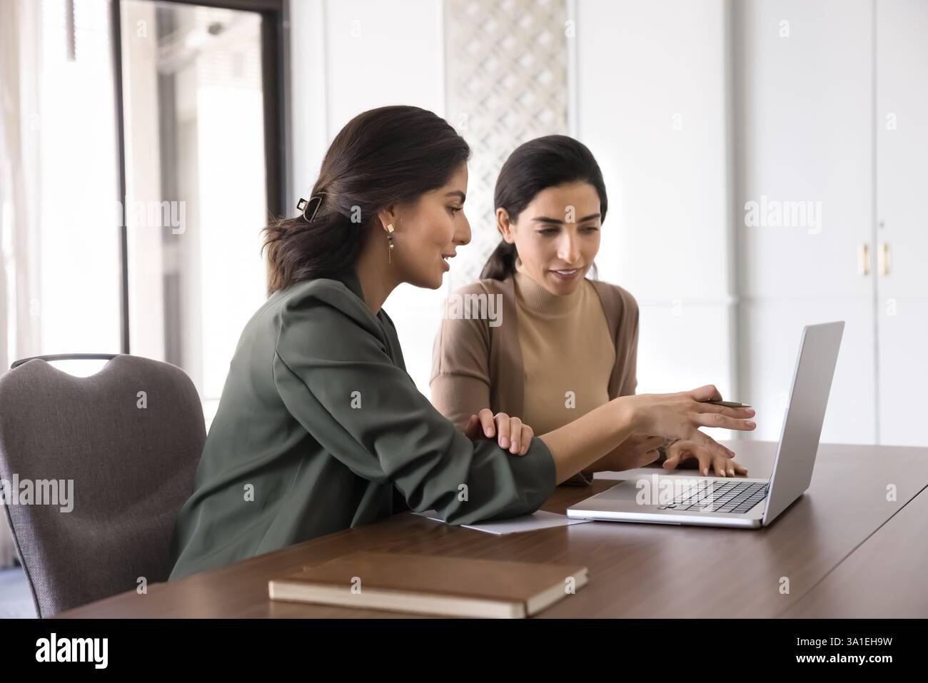 Colleagues sit desk reviewing hi-res stock photography and images - Alamy