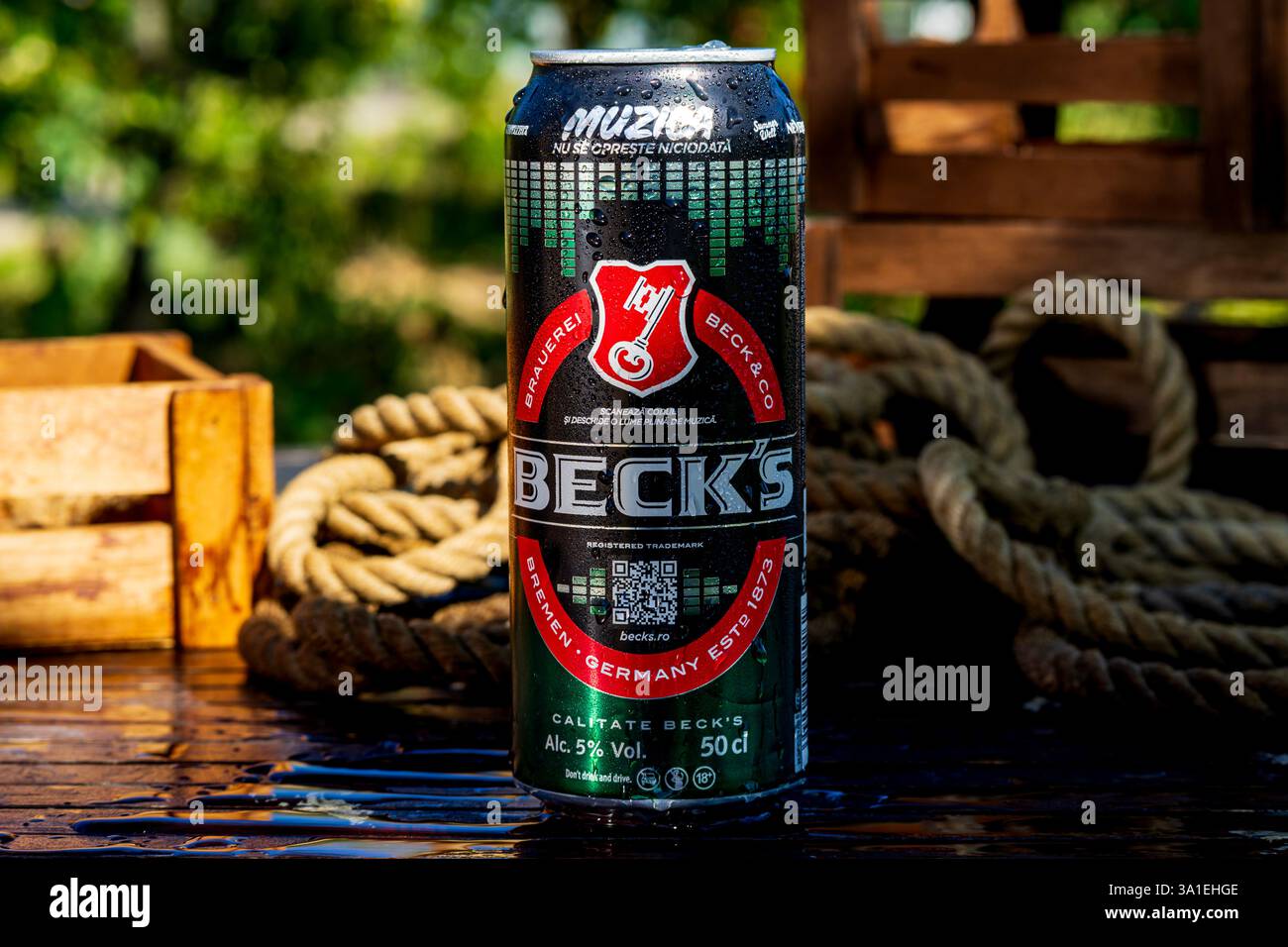 Beck's beer can - condensation water droplets, outdoors background ...
