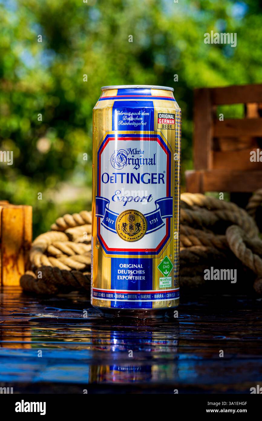 Oettinger beer can - condensation water droplets, outdoors background ...