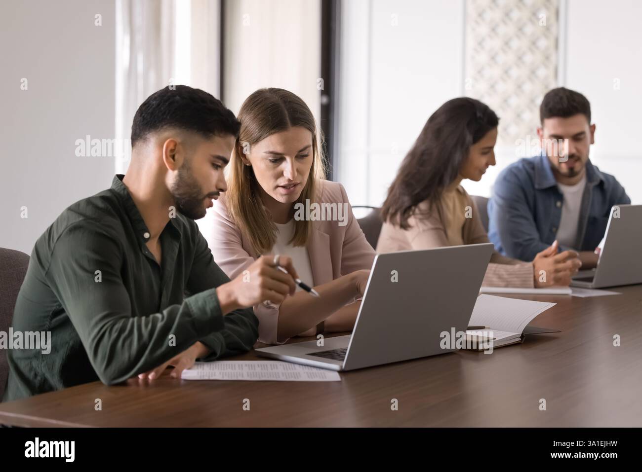 Reviewing team examining data hi-res stock photography and images - Alamy