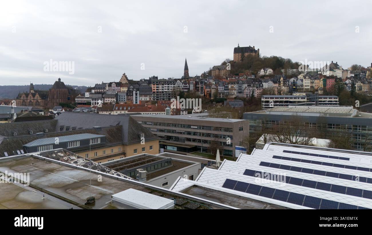 Panoramic view of Marburg, Germany, featuring solar panels on a rooftop ...
