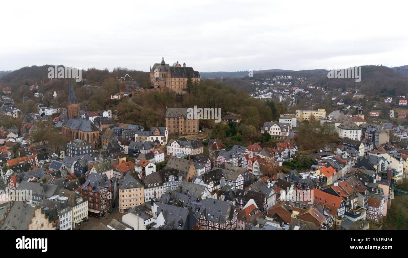 High-angle view of Marburg, Germany, showcasing Marburg Castle atop a ...