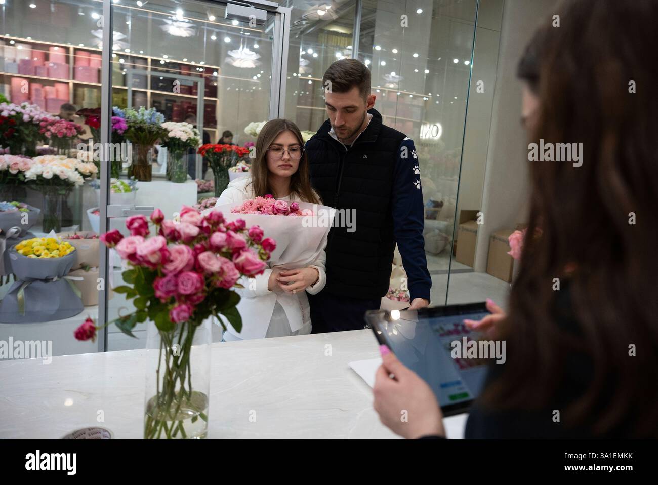Yelena Biloivan, 24, and Pavlo Horlov, 27, buy roses in «Only Rose» shop in central Kyiv ...