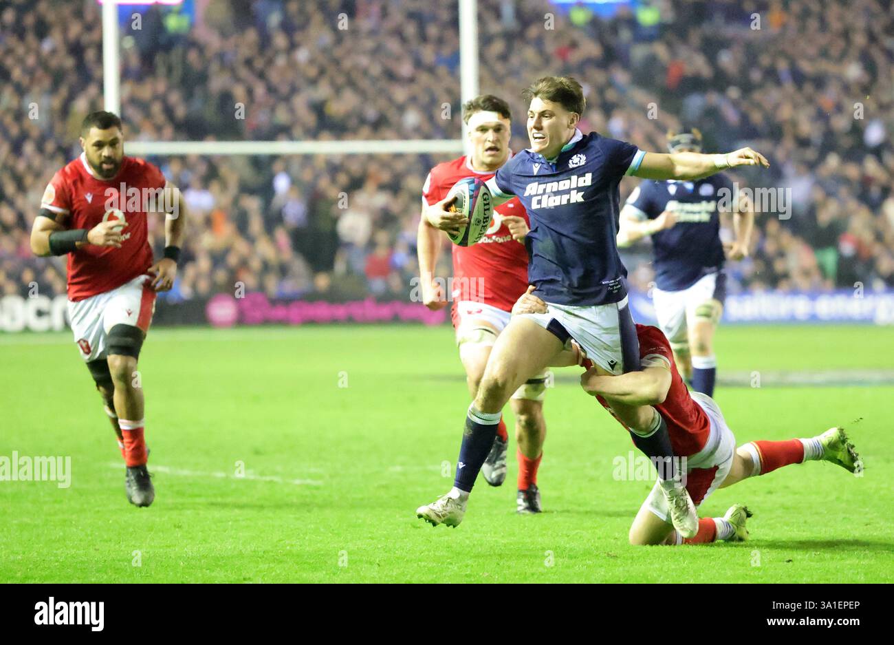 Scotland's Tom Jordan tackled by Wales' Joe Roberts during the Guinness ...