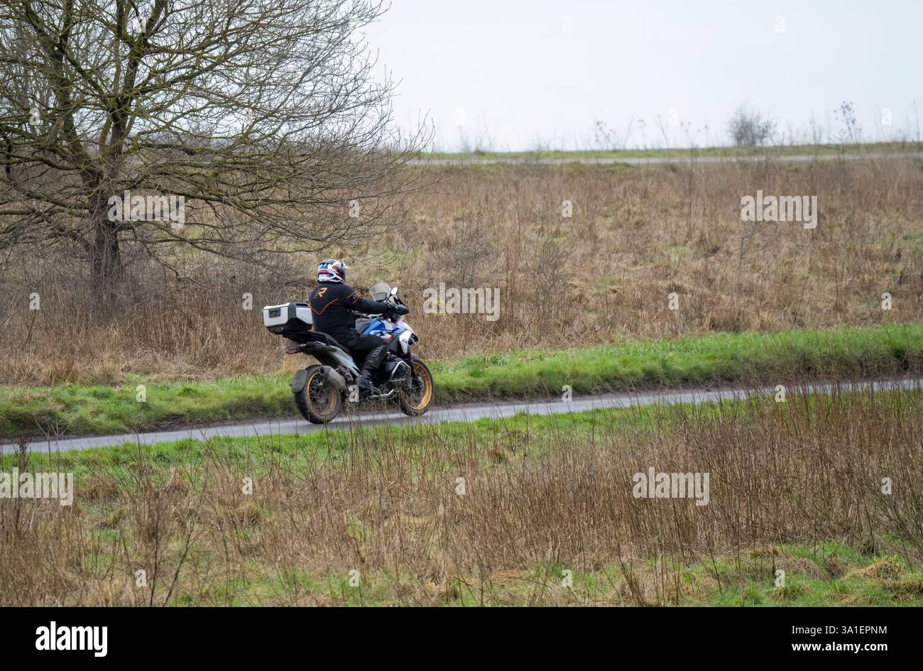Motorcyclist riding through national park hi-res stock photography and ...