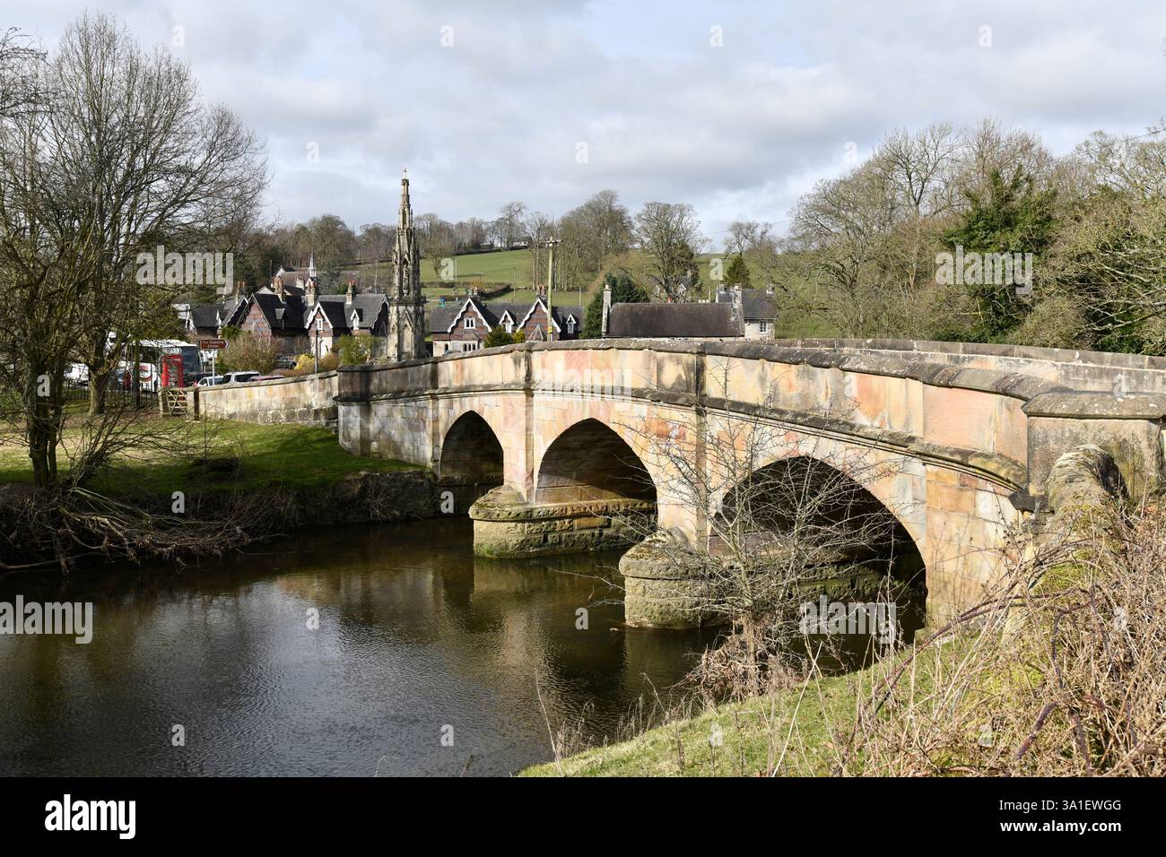 Stone arch bridge over River Manifold in The Staffordshire village of ...