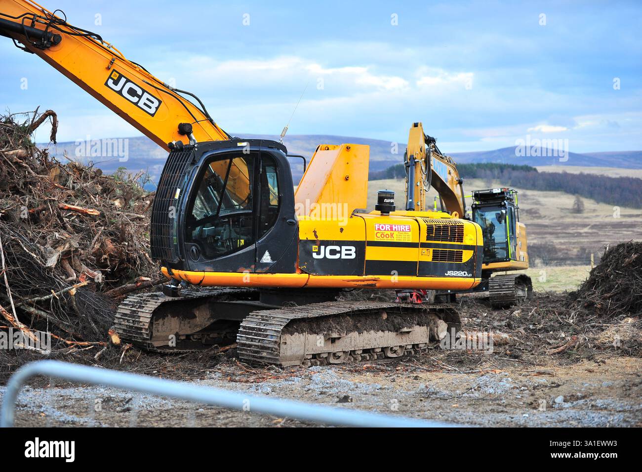Tomatin, UK. 8th March, 2025 - Diggers are seen with grabbing ...