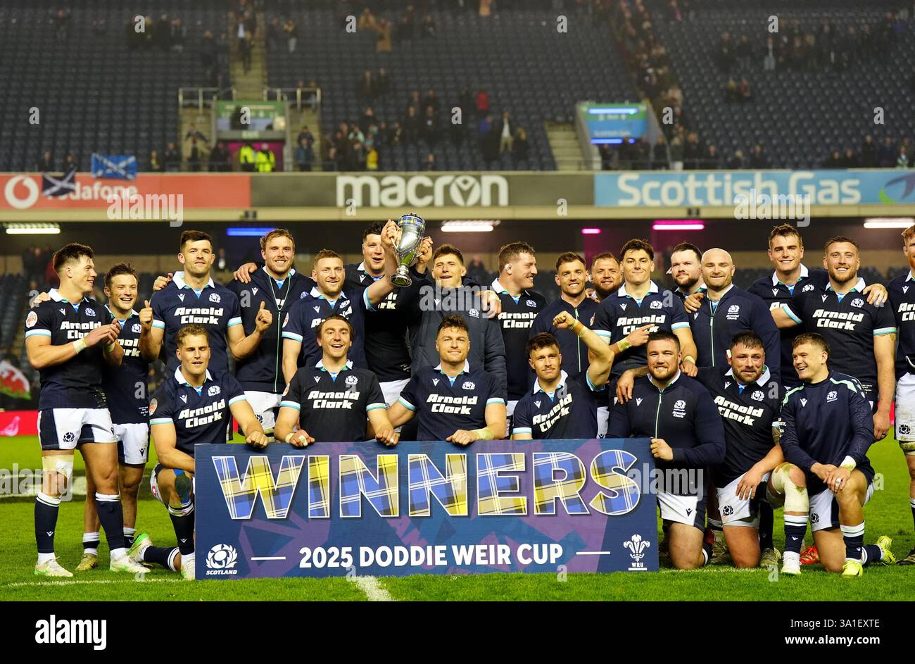 Scotland players celebrate with the Doddie Weir Cup following the ...