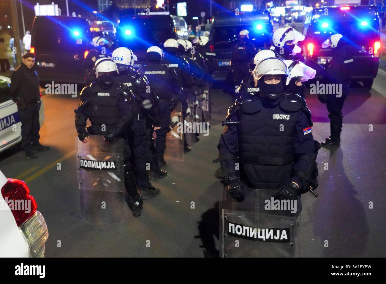 Serbian police officers block a bridge when students and citizens march ...