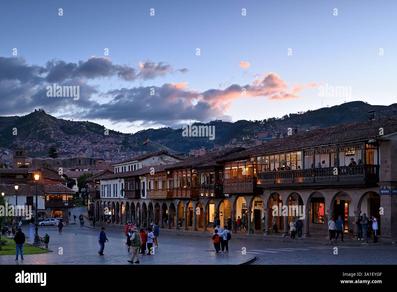 Colonial buildings with balconies and arcades at dusk in Plaza de Armas ...