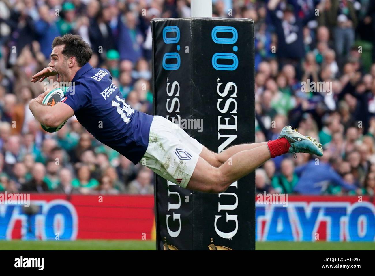 France's Damian Penaud scores their side's fifth try of the game during ...
