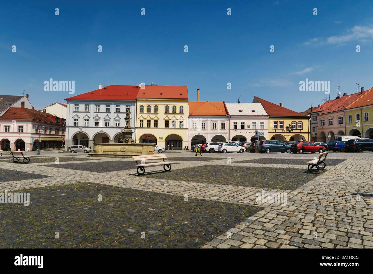 A picturesque town square with colorful historic buildings, cobblestone ...