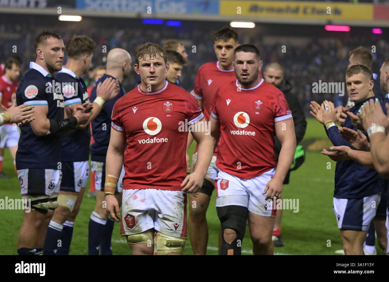 Edinburgh, UK. 8th Mar, 2025. Jac Morgan of Wales leads his team off ...