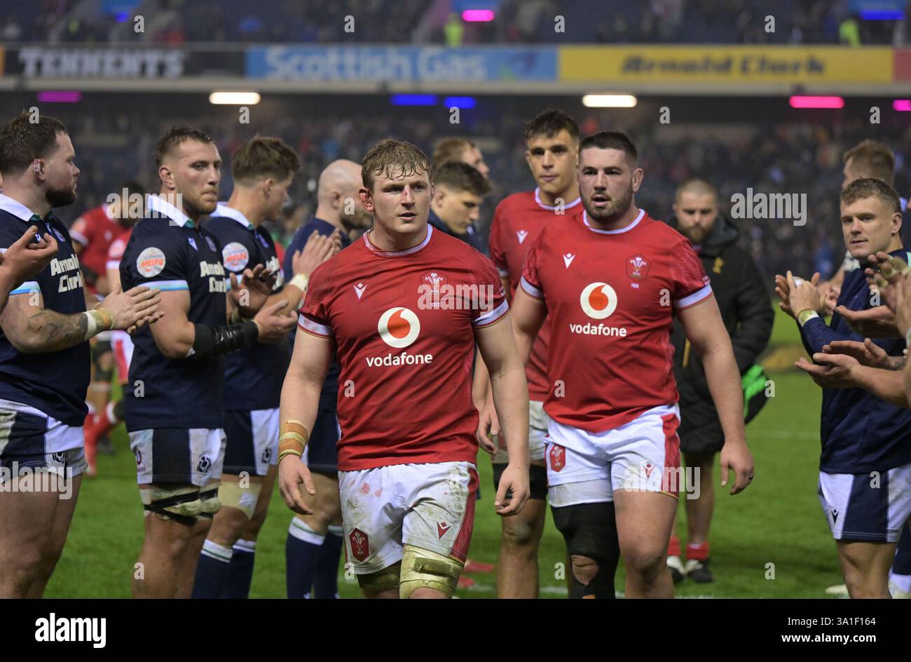 Edinburgh, UK. 8th Mar, 2025. Jac Morgan of Wales leads his team off ...