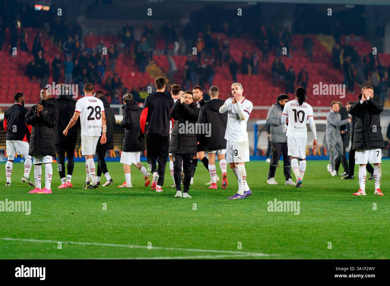 Lecce, Italy. 08th Mar, 2025. the AC Milan players applauds fans during ...
