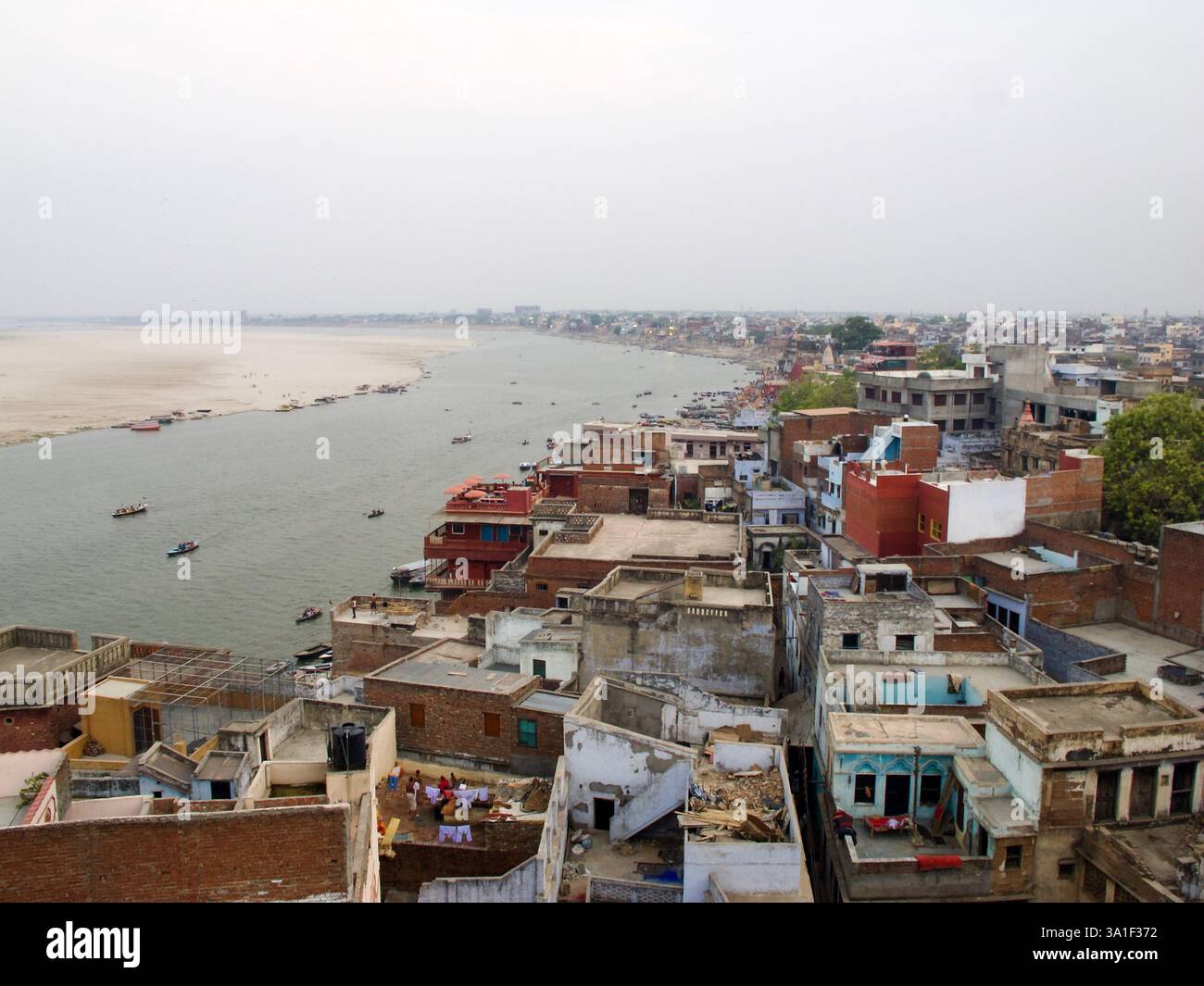 Panoramic view of Varanasi rooftops and the Ganges River, with exposed ...