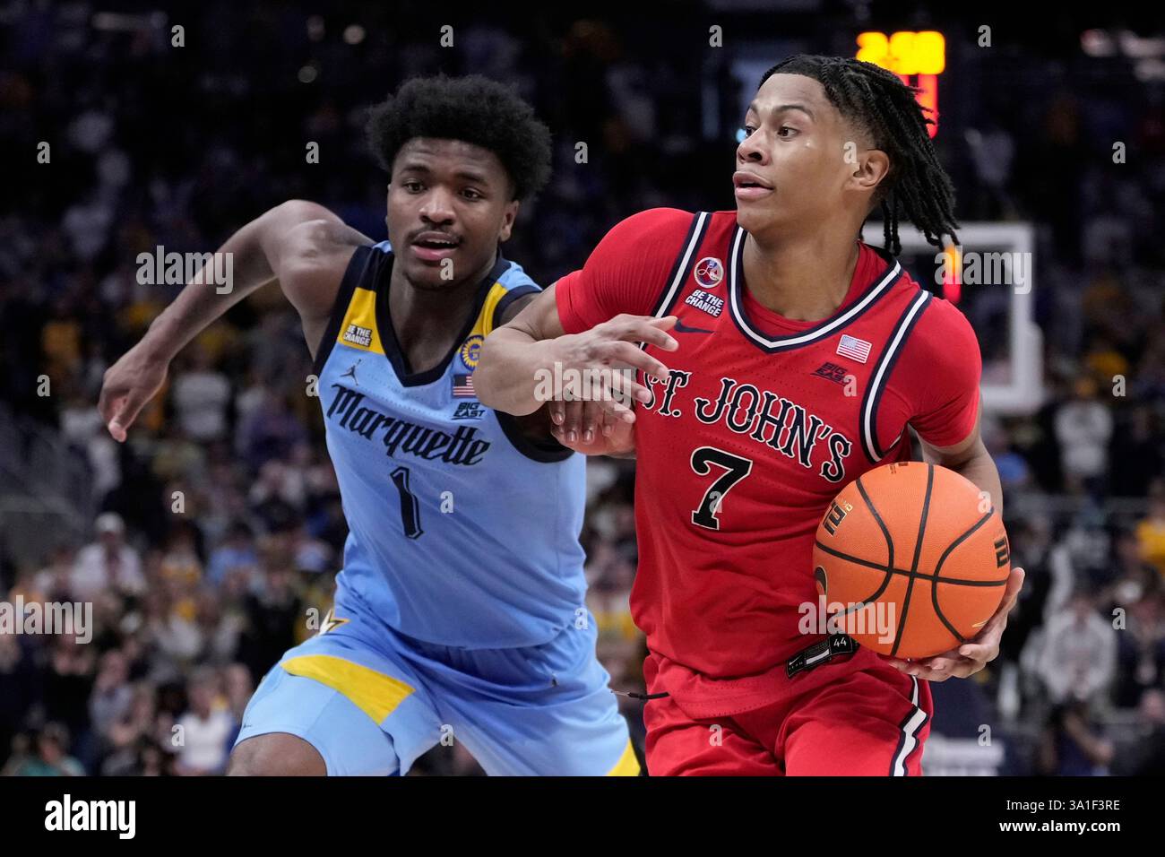 St. John's's Simeon Wilcher gets past Marquette's Kam Jones during the ...
