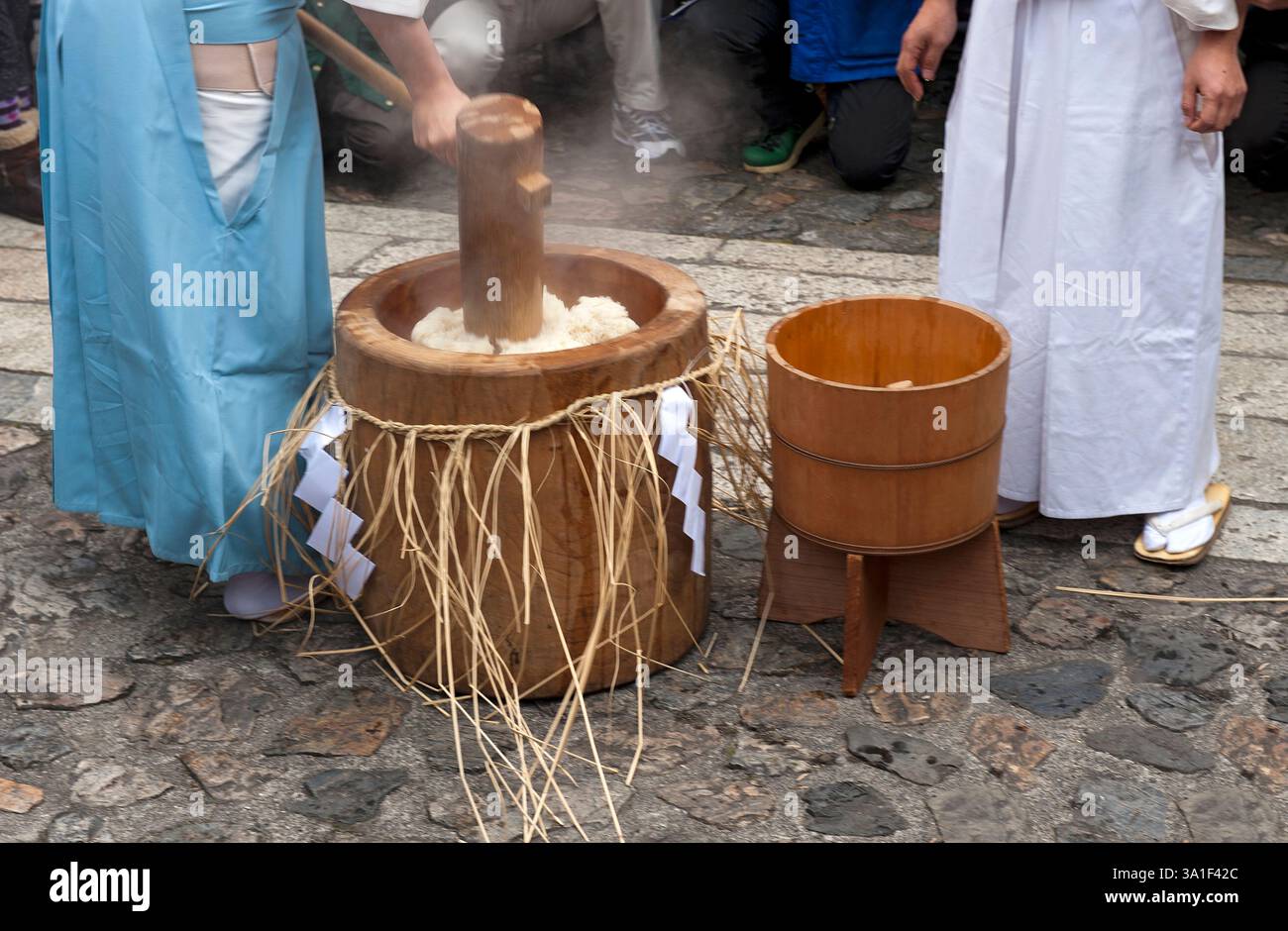 Mochitsuki, making traditional Japanese rice cakes by hand with pestle ...
