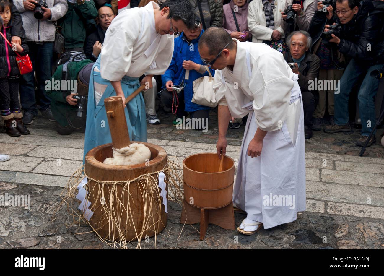 Mochitsuki, making traditional Japanese rice cakes by hand with pestle ...