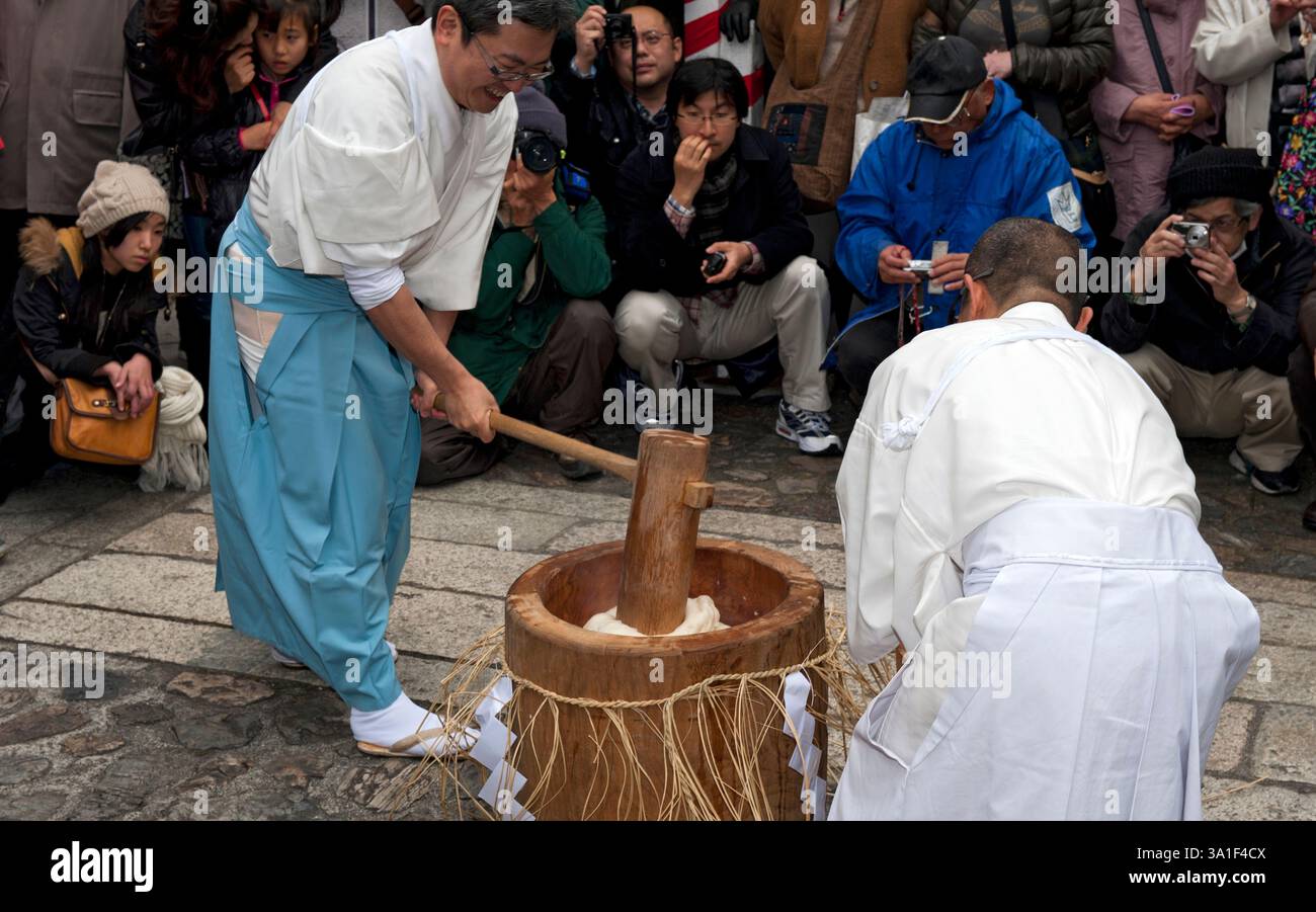 Mochitsuki, making traditional Japanese rice cakes by hand with pestle ...
