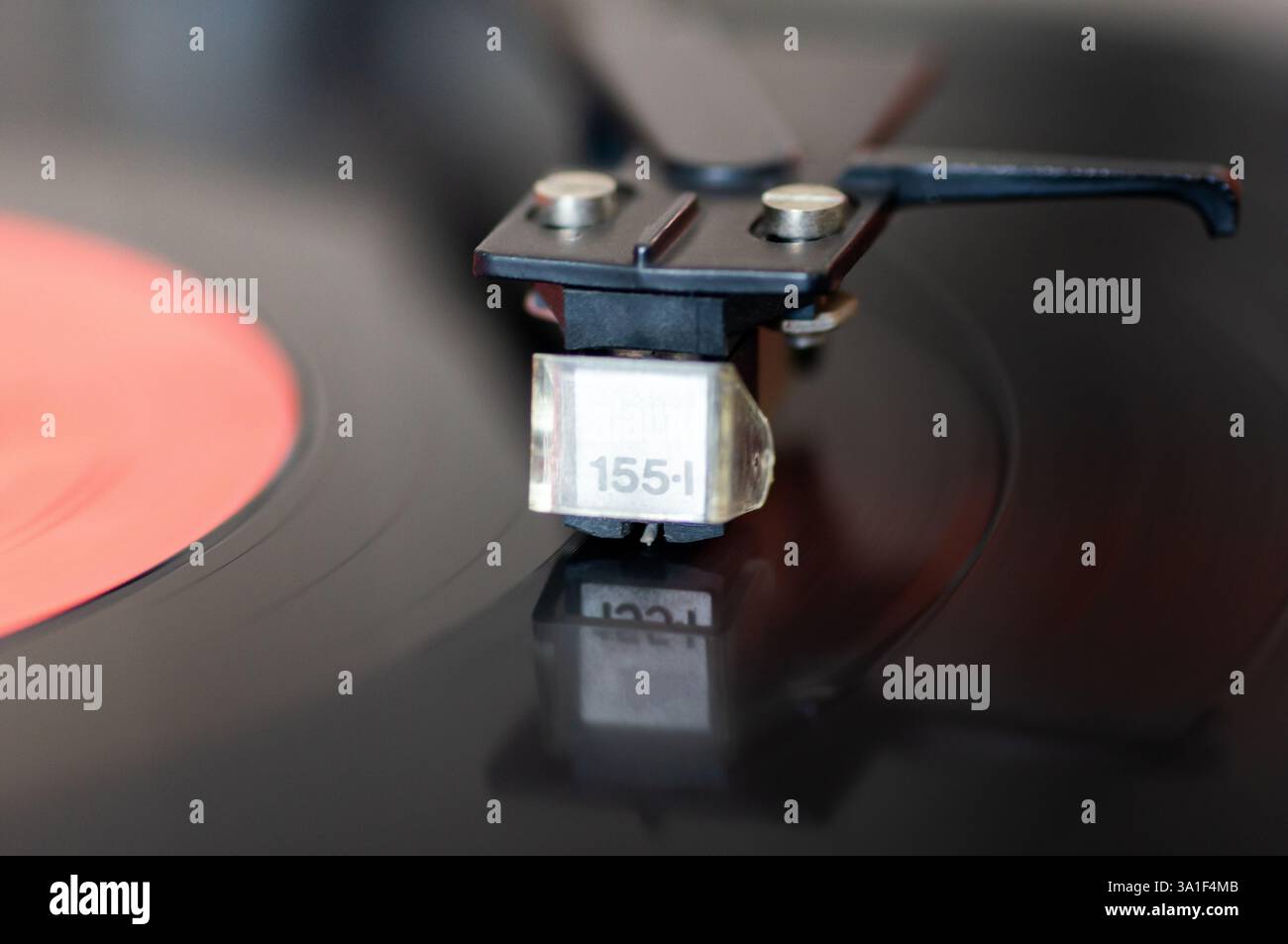 Close-up of a cartridge head on a vinyl record, analog retro music ...