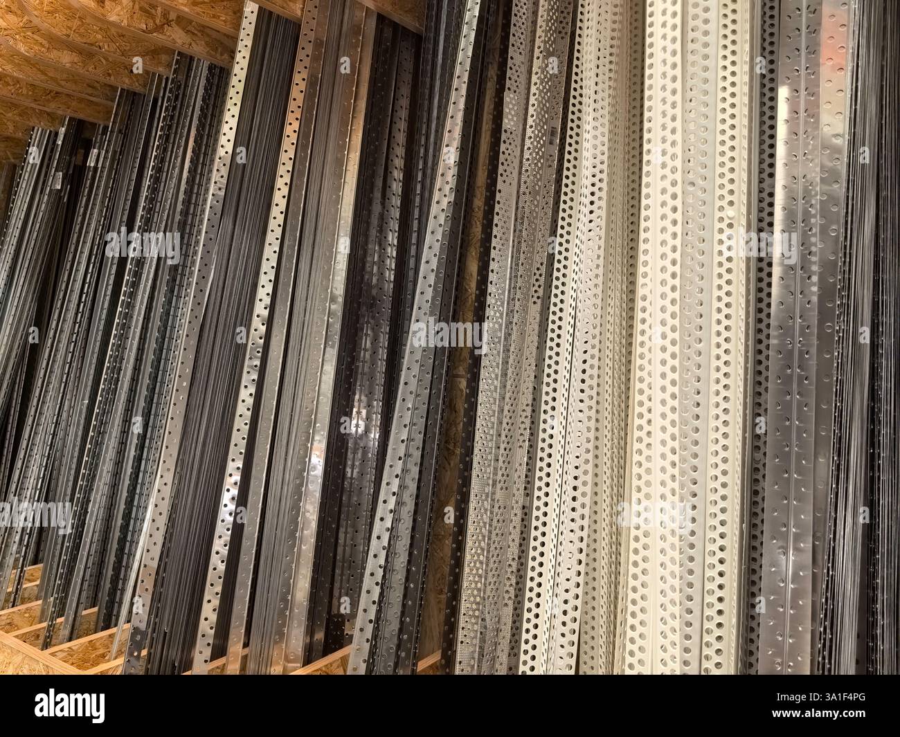 A structured arrangement of metal racks showcases an array of materials ...