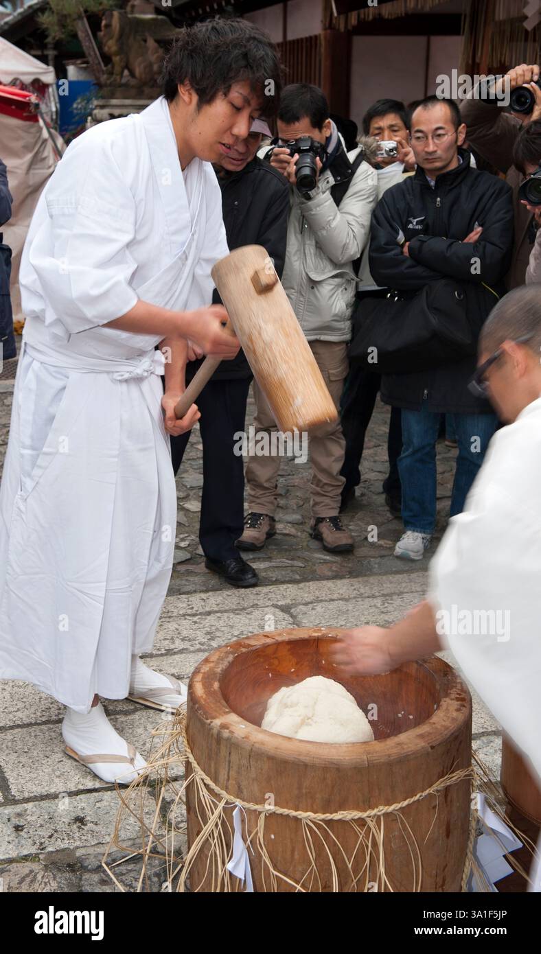 Mochitsuki, making traditional Japanese rice cakes by hand with pestle ...