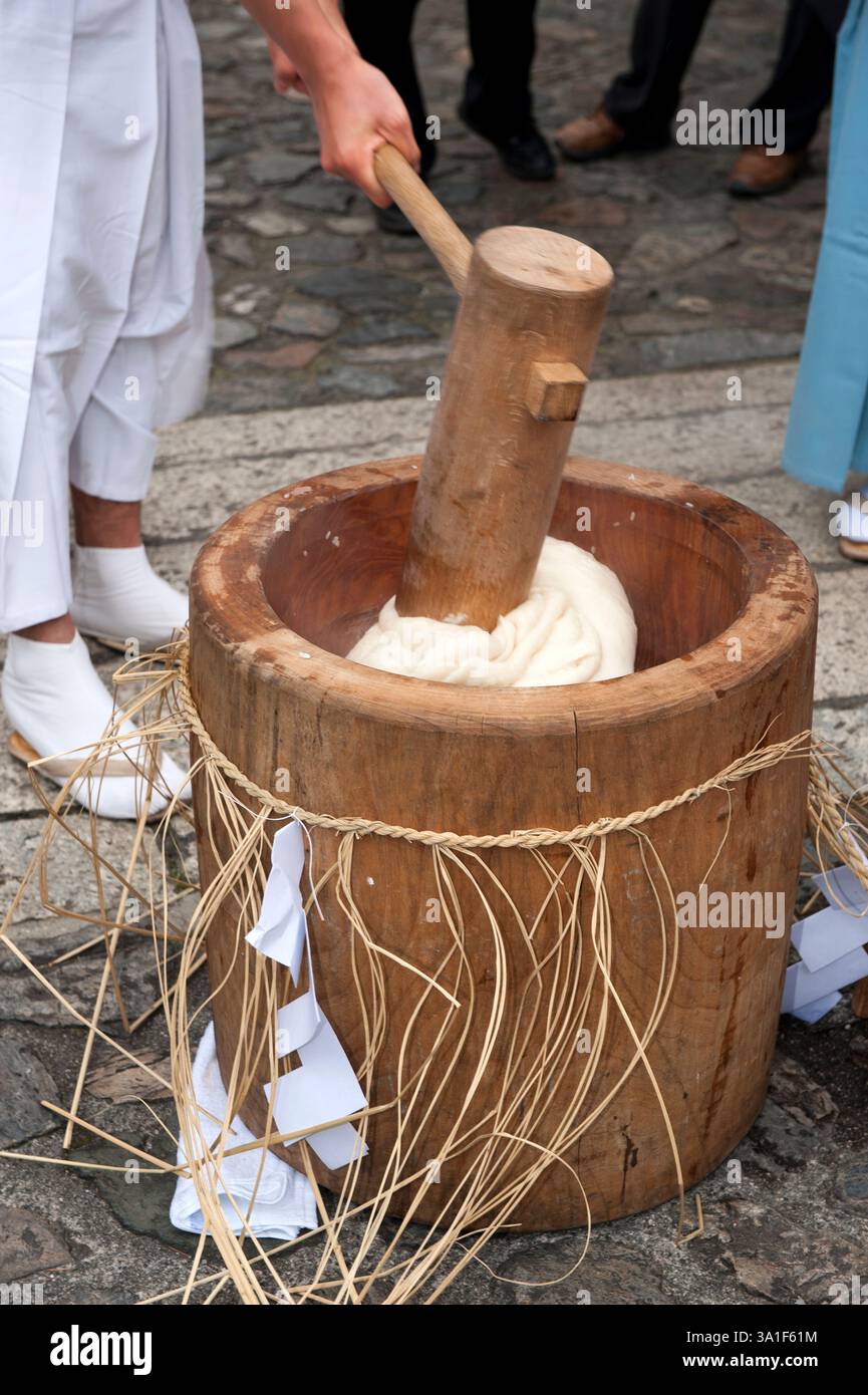 Mochitsuki, making traditional Japanese rice cakes by hand with pestle ...
