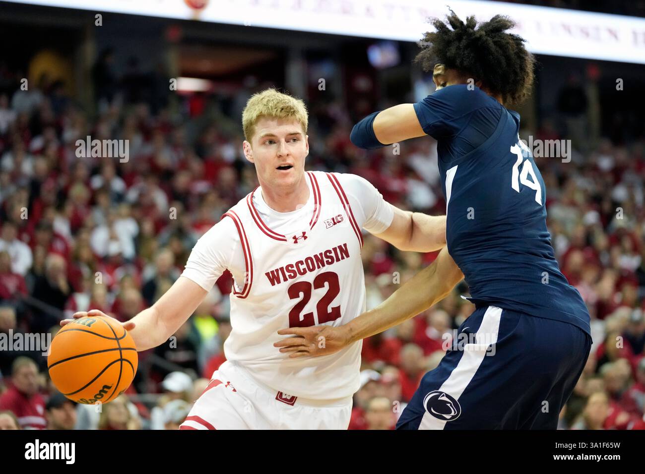 Wisconsin forward Steven Crowl (22) drives against Penn State forward ...