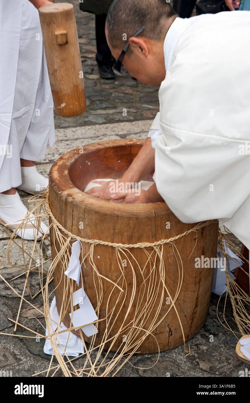 Mochitsuki, making traditional Japanese rice cakes by hand with pestle ...