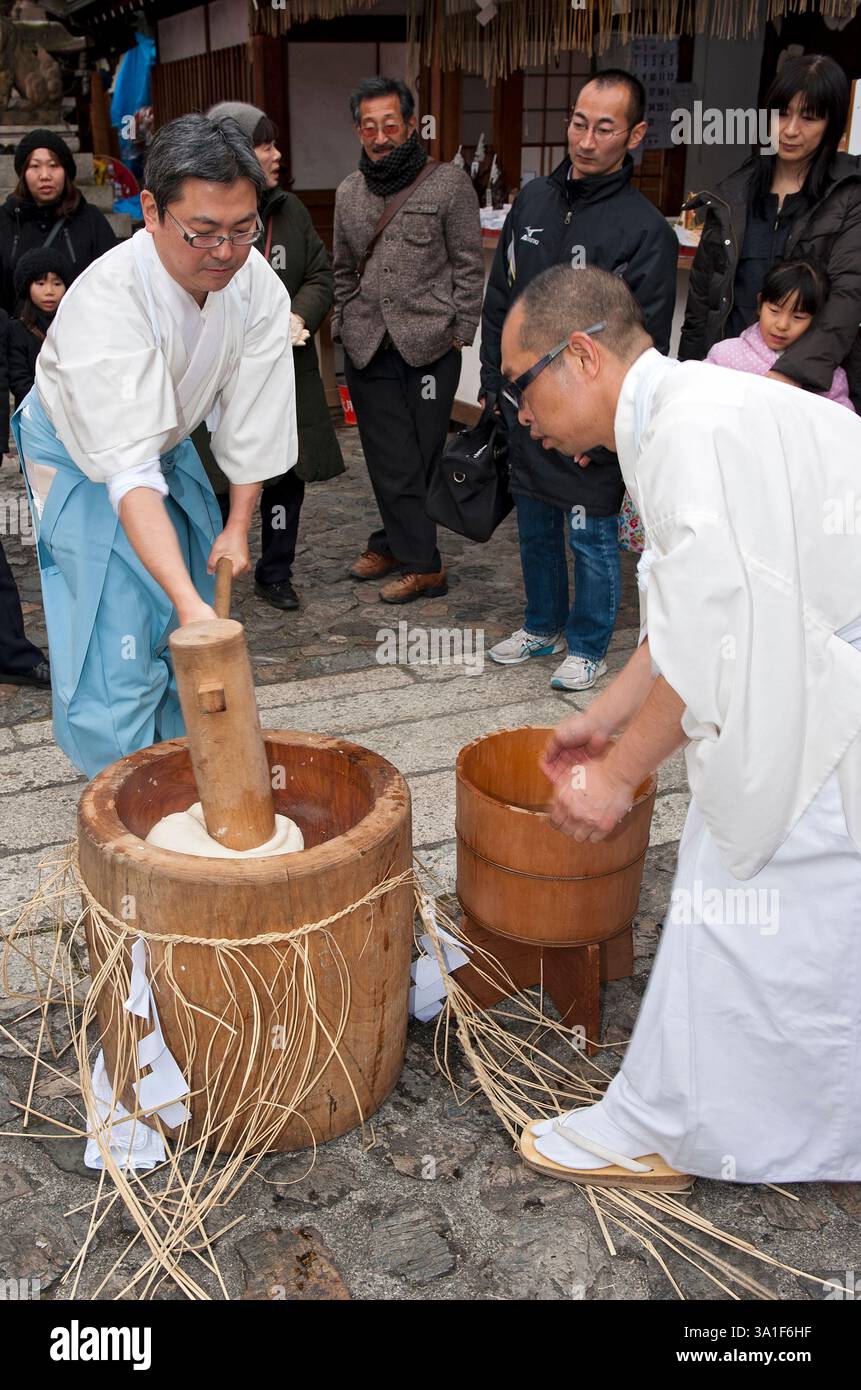 Mochitsuki, making traditional Japanese rice cakes by hand with pestle ...