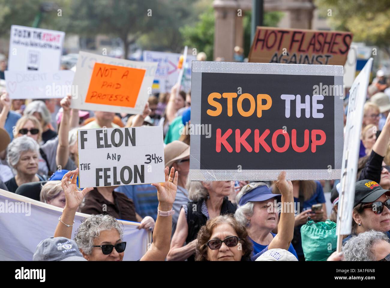 Austin Texas USA, March 8 2025: Protesters hold anti-Donald Trump and ...