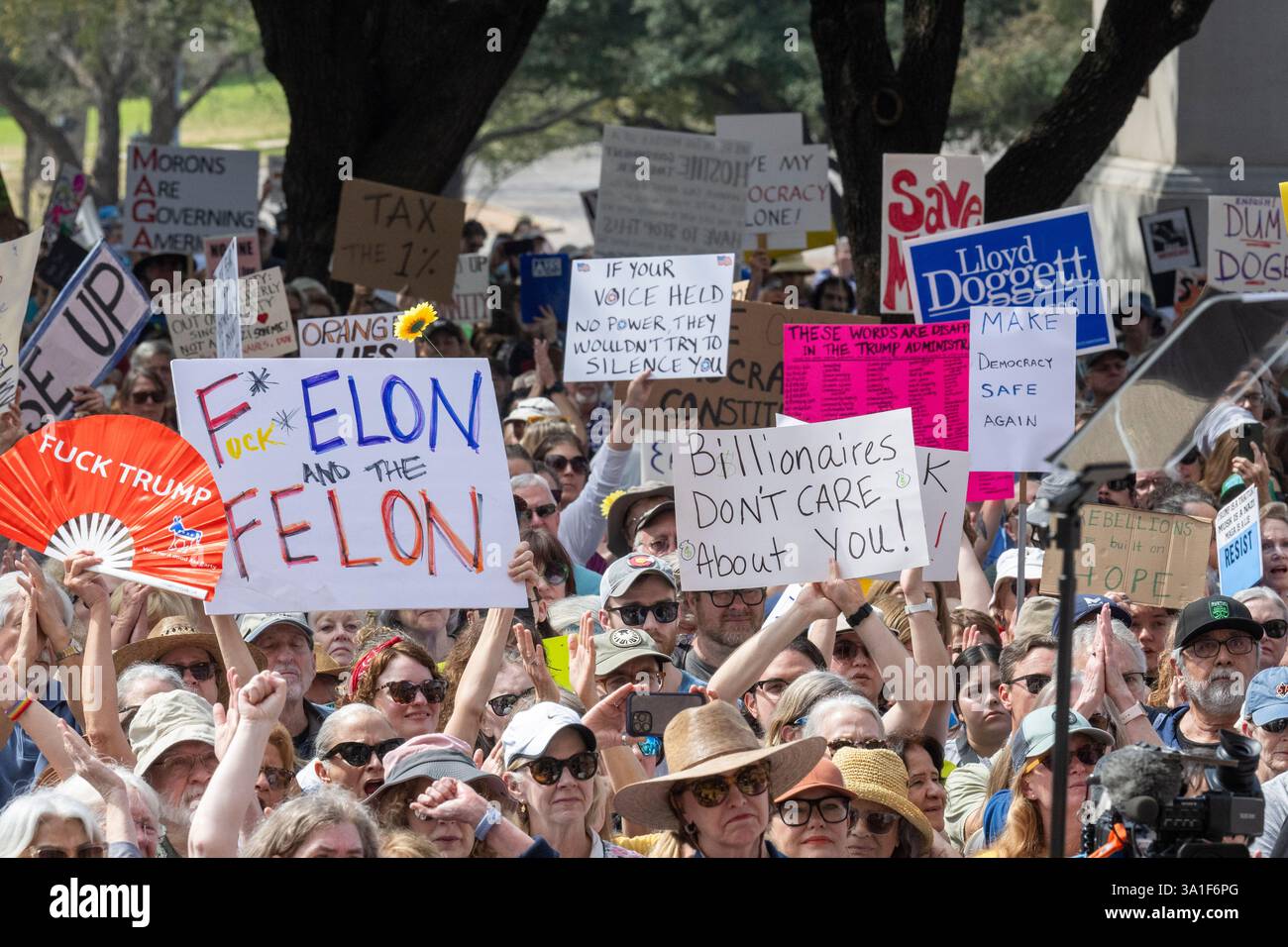Austin Texas USA, March 8 2025: Protesters hold anti-Donald Trump and ...
