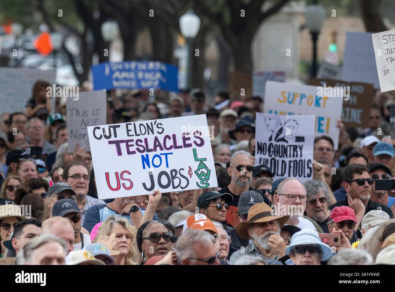 Austin Texas USA, March 8 2025: Protesters hold anti-Donald Trump and ...