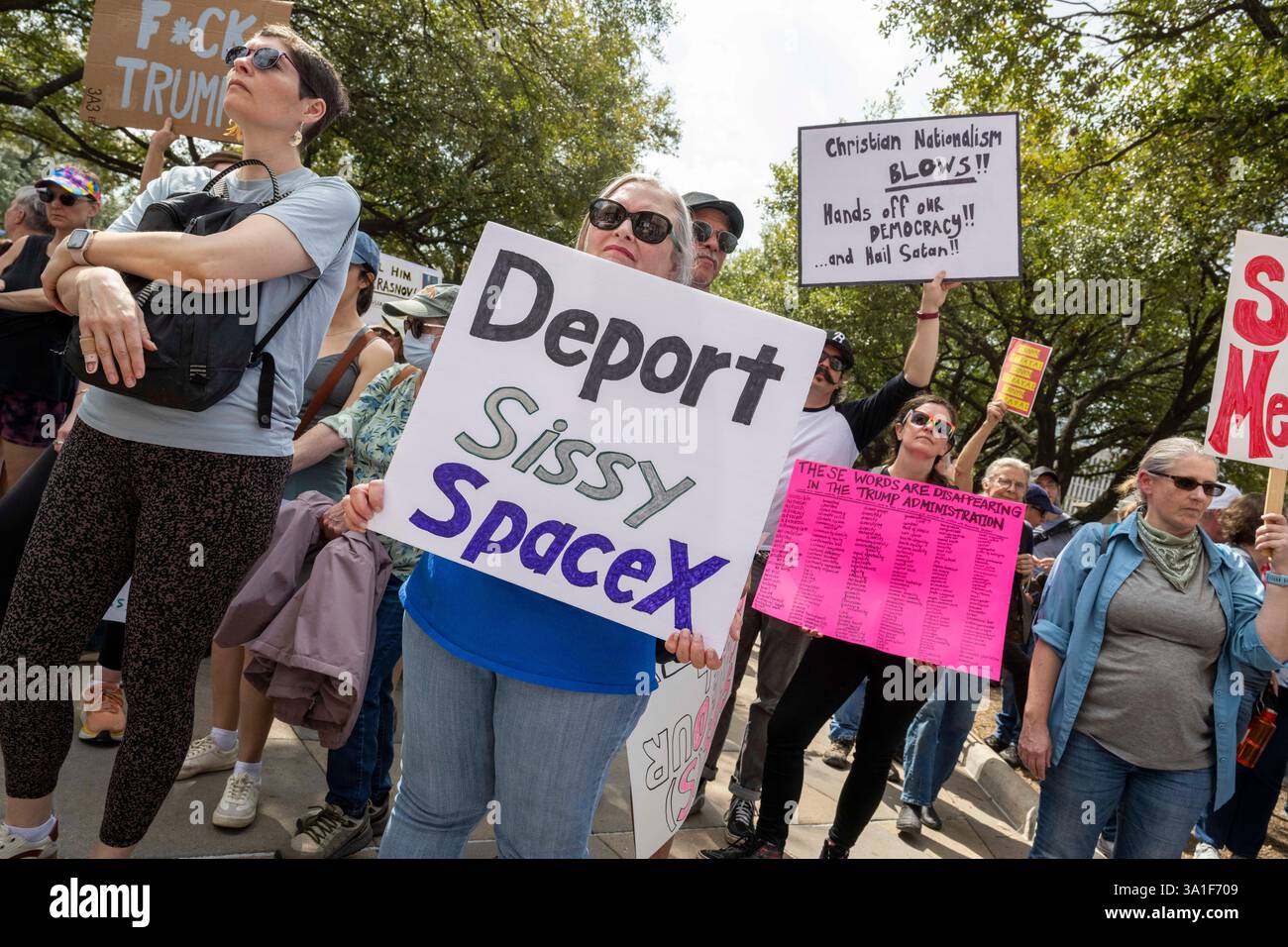 Austin Texas USA, March 8 2025: Protesters hold anti-Donald Trump and ...