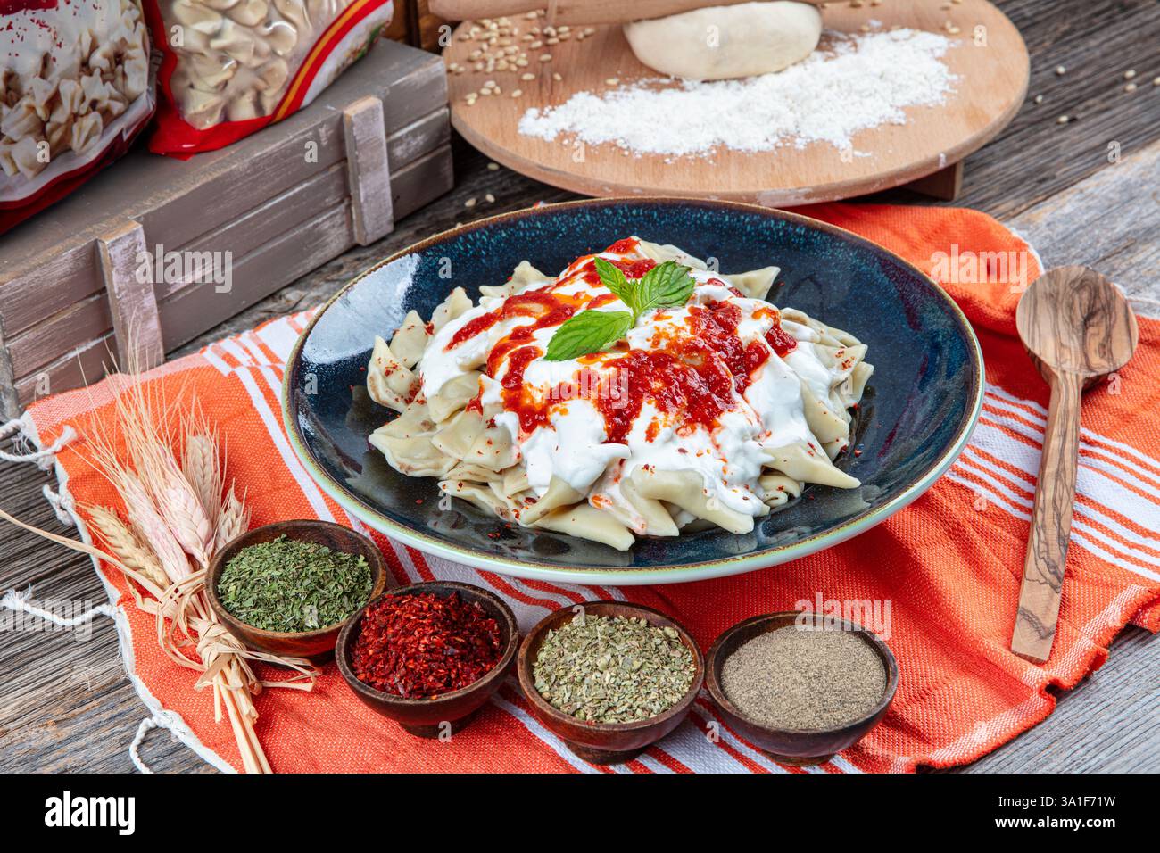 Turkish Manti dish. Turkish Ravioli (Manti) with yoghurt and tomato ...