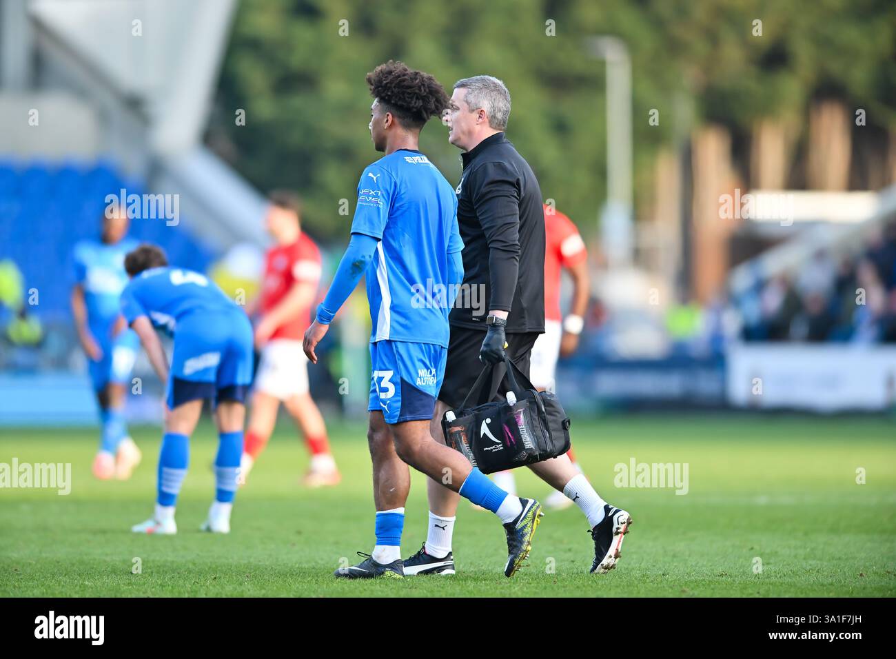 James Donnelly (33 Peterborough United) goes off the pitch injured ...