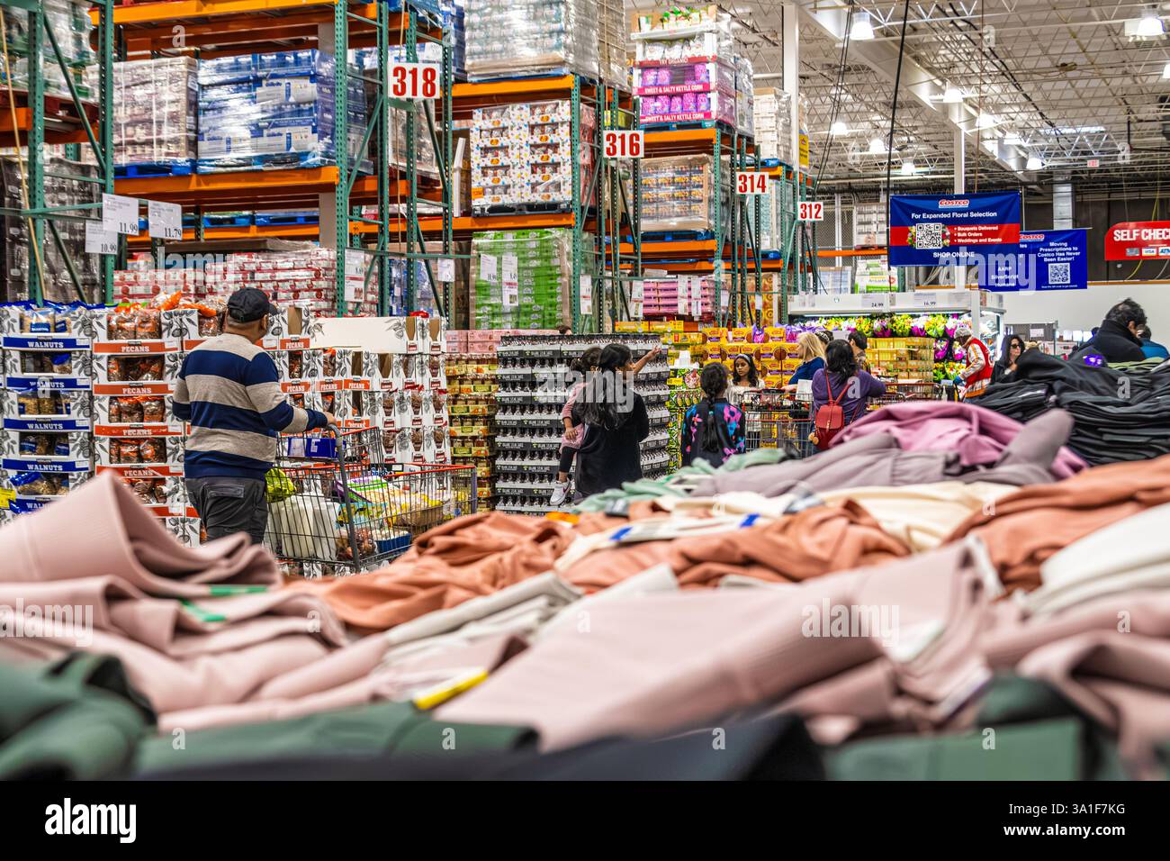 Shopper navigate amongst the vast array of bulk item foods and ...