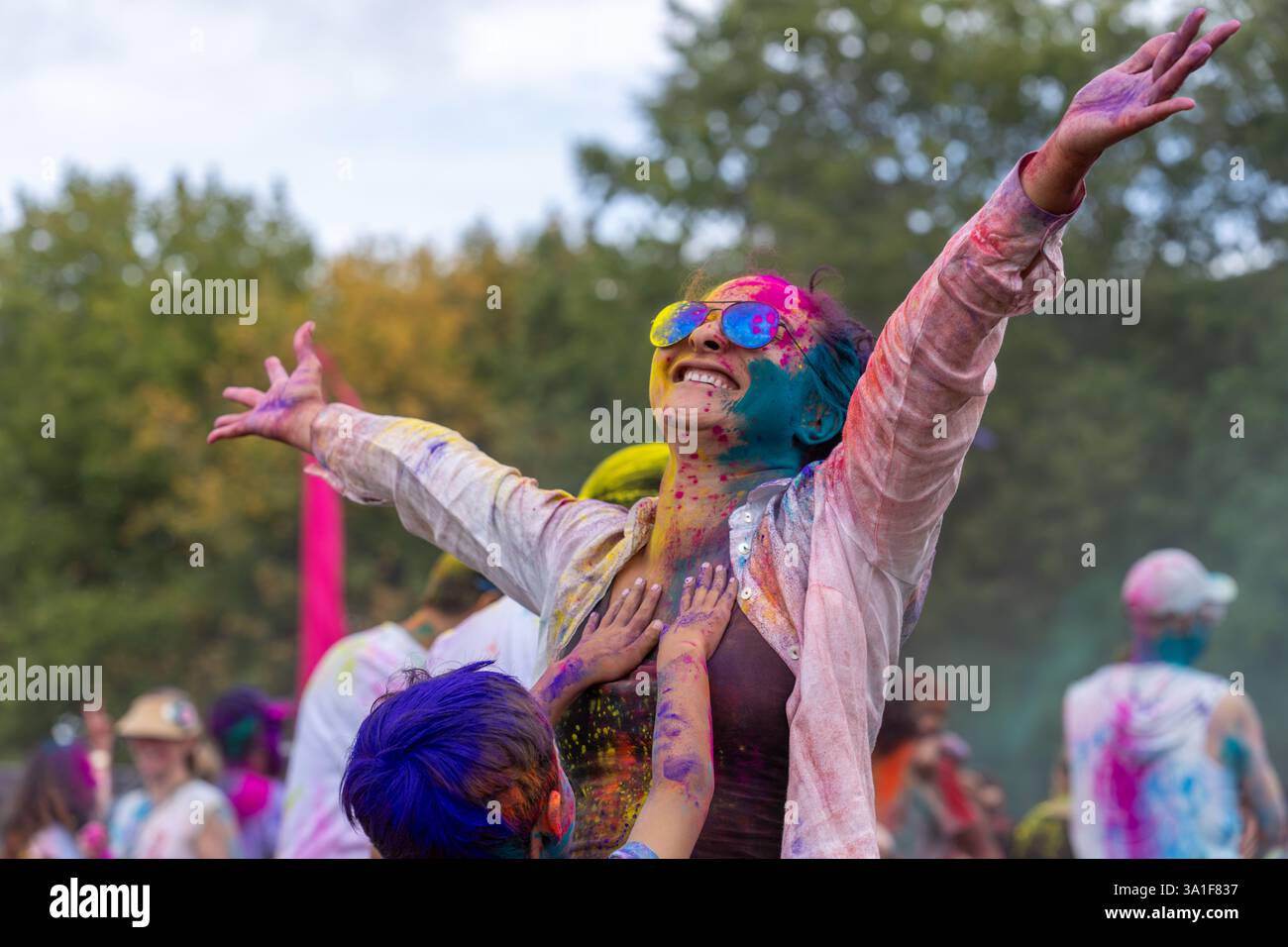 Tauranga New Zealand - March 8 2025; People cover in colours ...