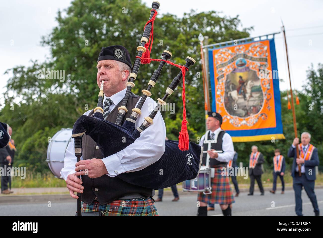 Kilted bagpipe band pipe band on Orange March, Tobermore, 2022 Stock ...