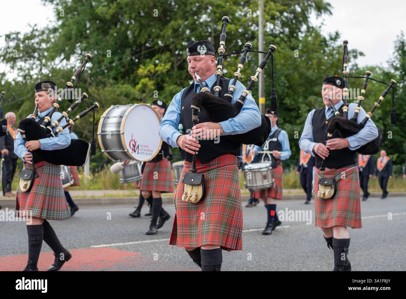 Kilted bagpipe band pipe band on Orange March, Tobermore, 2022 Stock ...