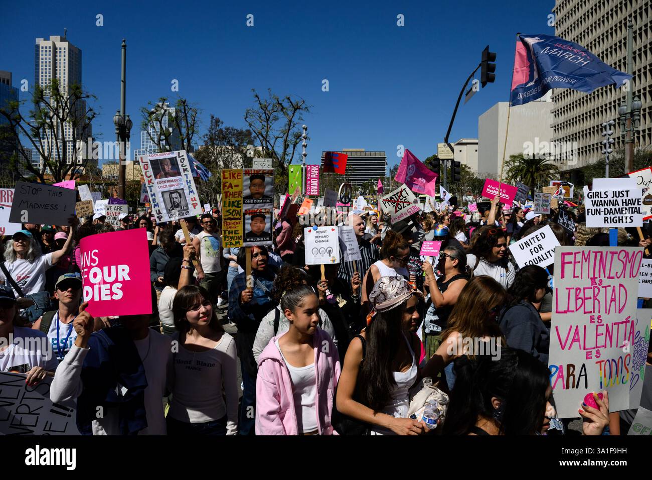 Demonstrators come together to form a crowd during a march to ...