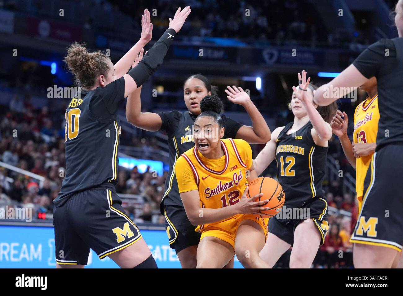 Southern California guard JuJu Watkins (12) drives on Michigan guard ...