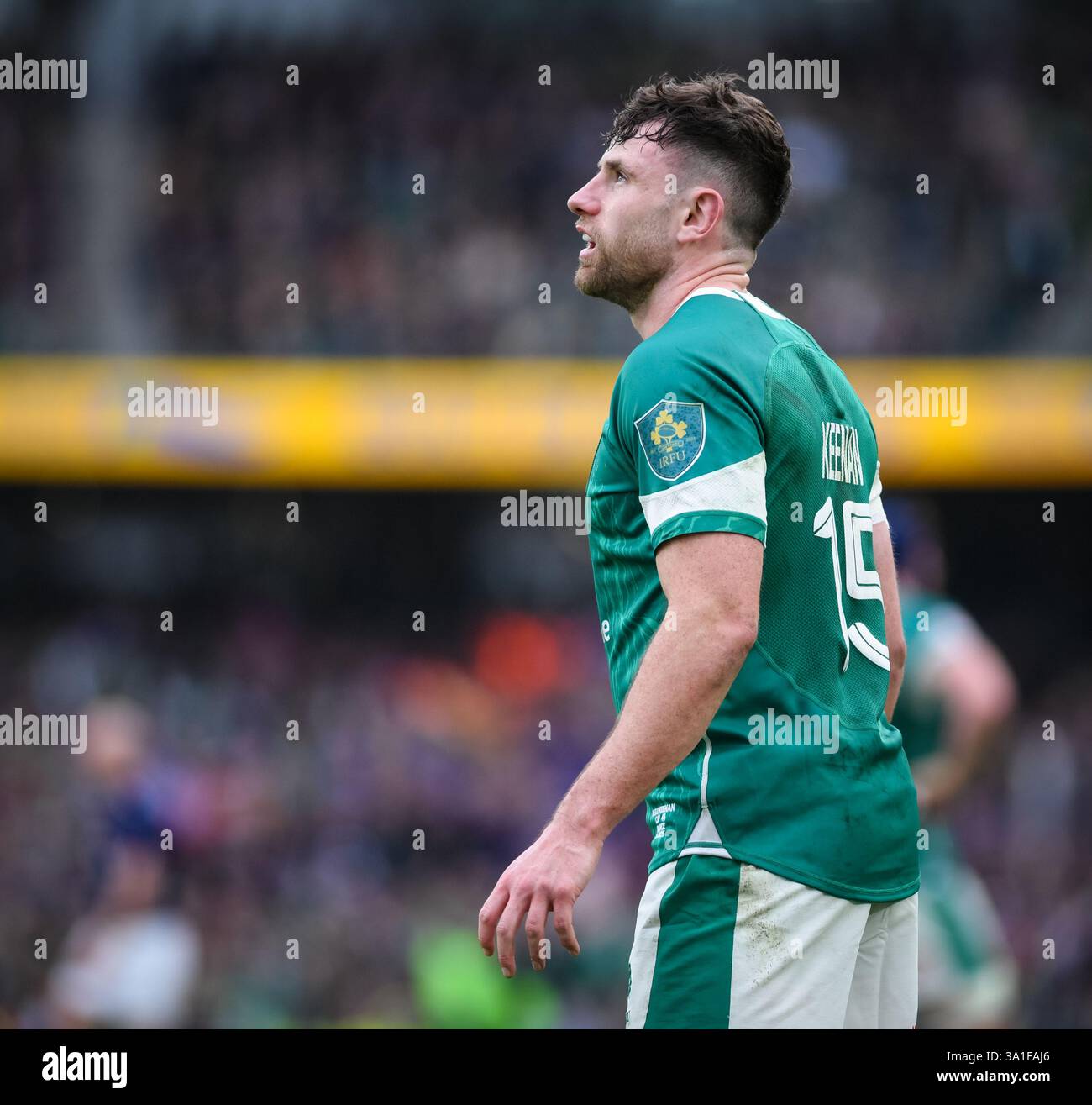 Dublin, Ireland. 8th March, 2025. Ireland's Hugo Keenan reacts to a ...