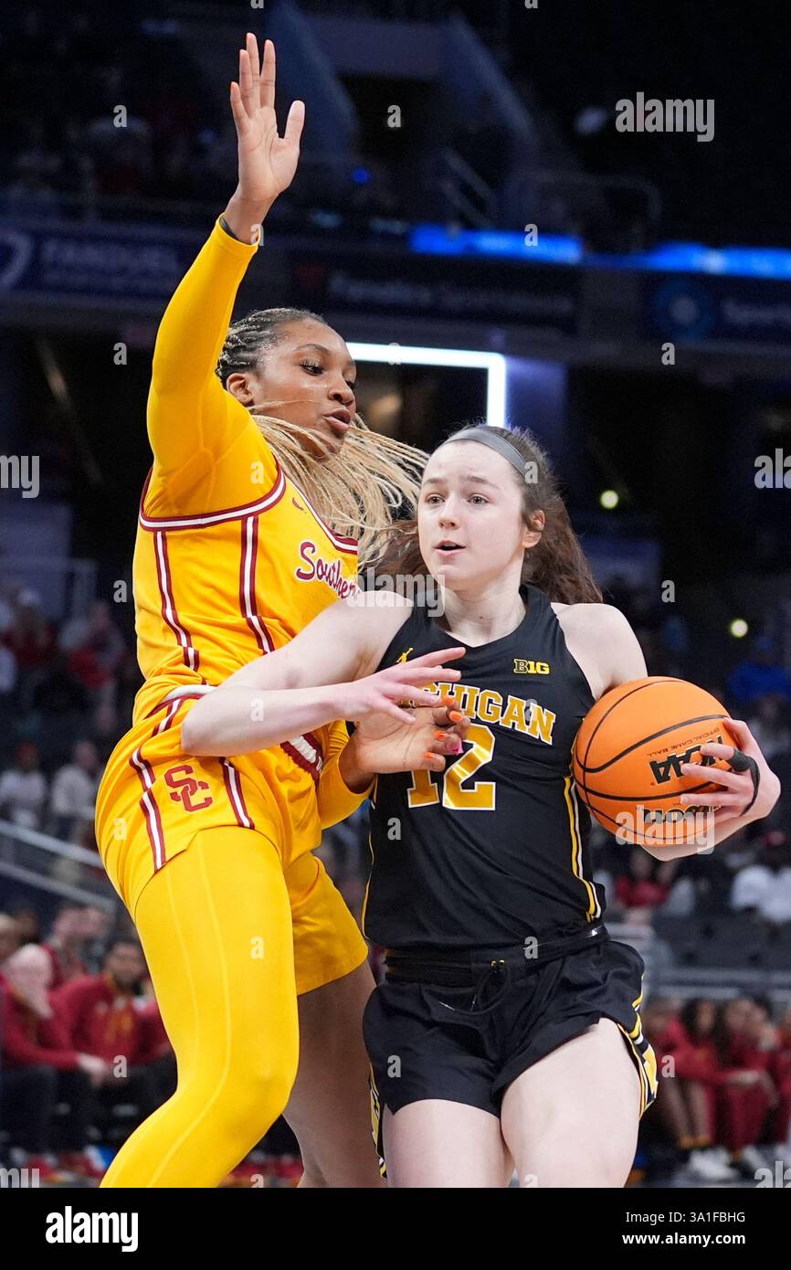 Michigan guard Syla Swords (12) drives on Southern California forward ...
