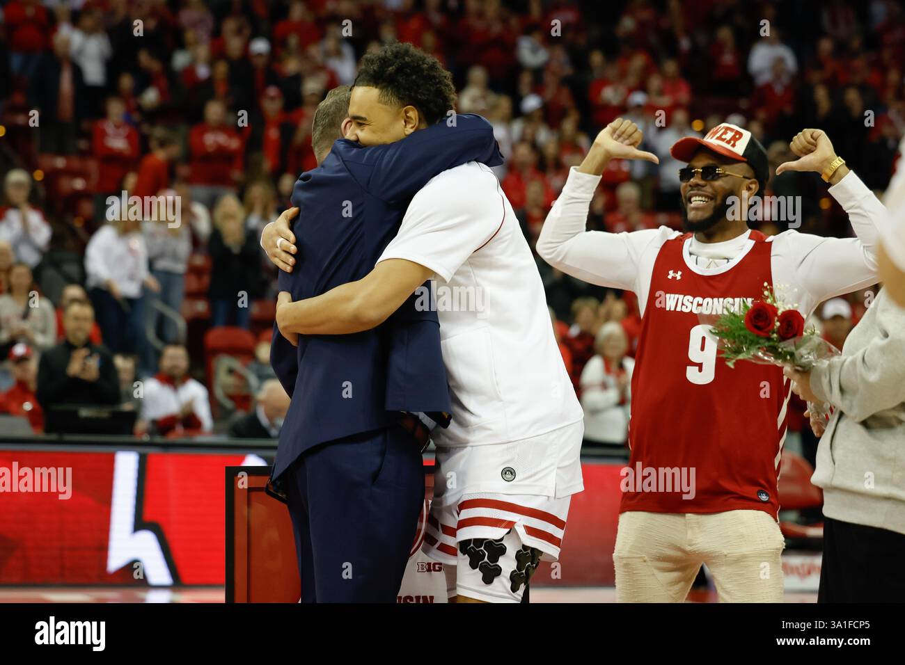 March 8, 2025: Wisconsin Badgers guard John Tonje (9) hugs head coach ...