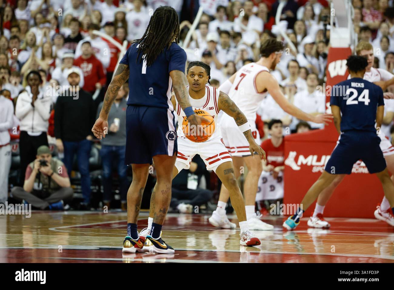 March 8, 2025: Wisconsin Badgers guard Kamari McGee (4) defends Penn ...