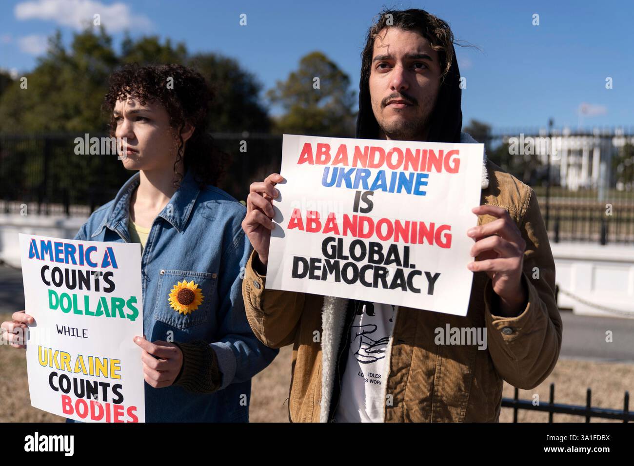 Demonstrators hold signs during a rally in support of Ukraine at The ...