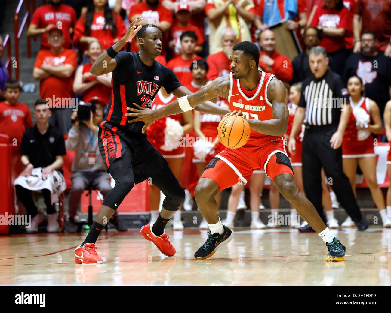 New Mexico center Nelly Junior Joseph dribbles the ball as UNLV's Papa ...